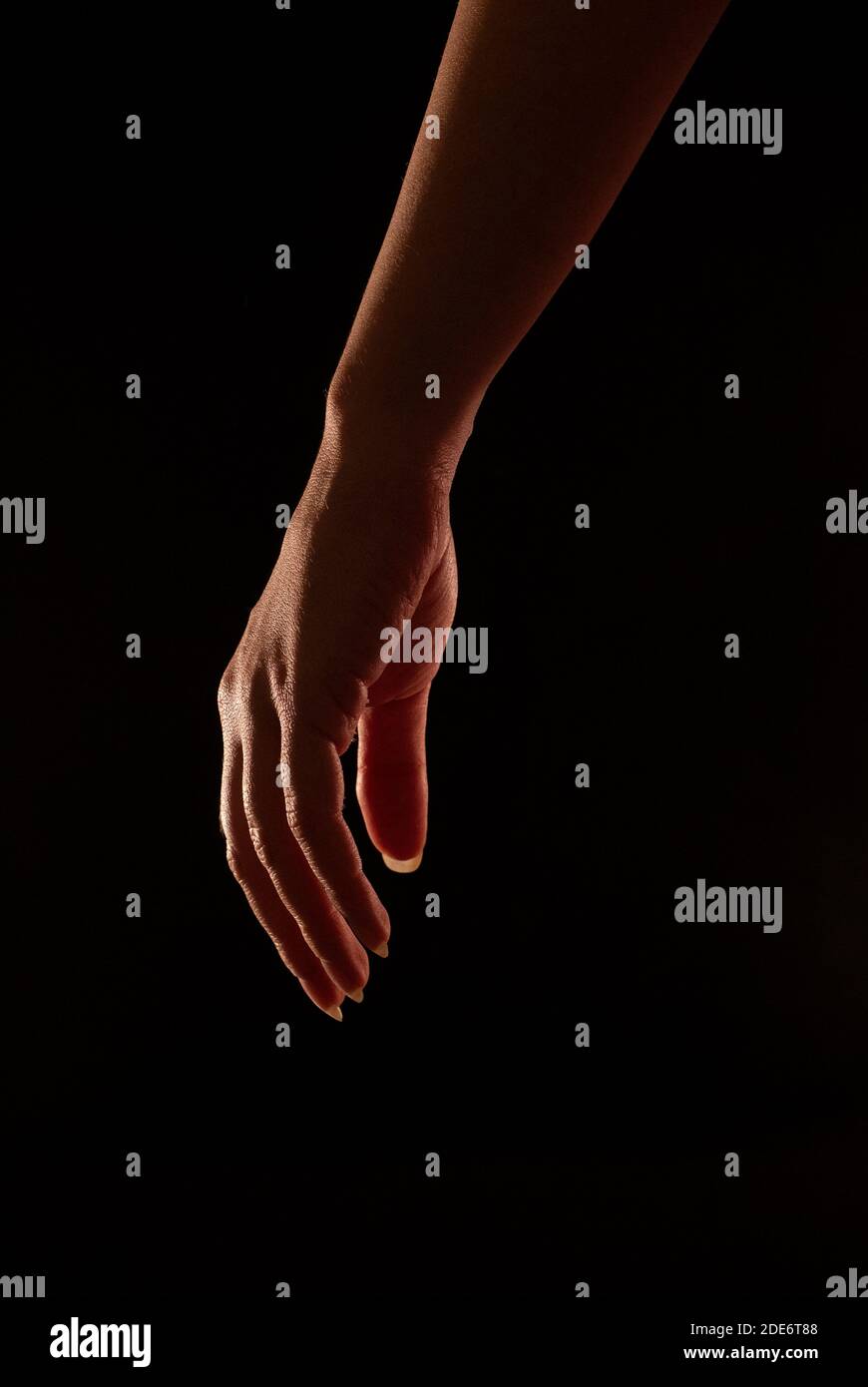 Beautiful Woman's Hand in Rim Light - Relaxed Stock Photo - Alamy