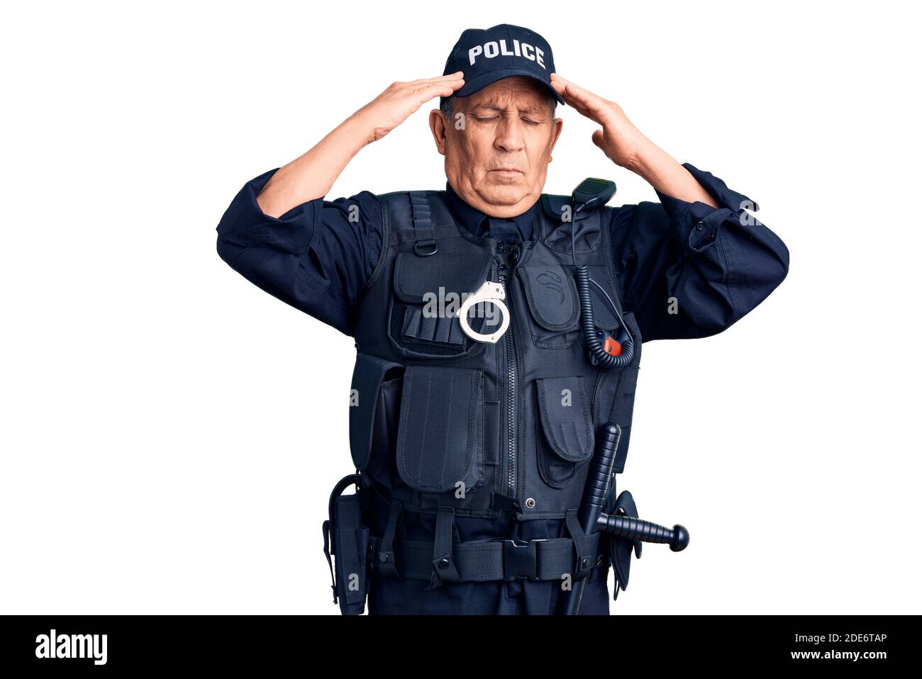 Senior handsome man wearing police uniform suffering from headache ...