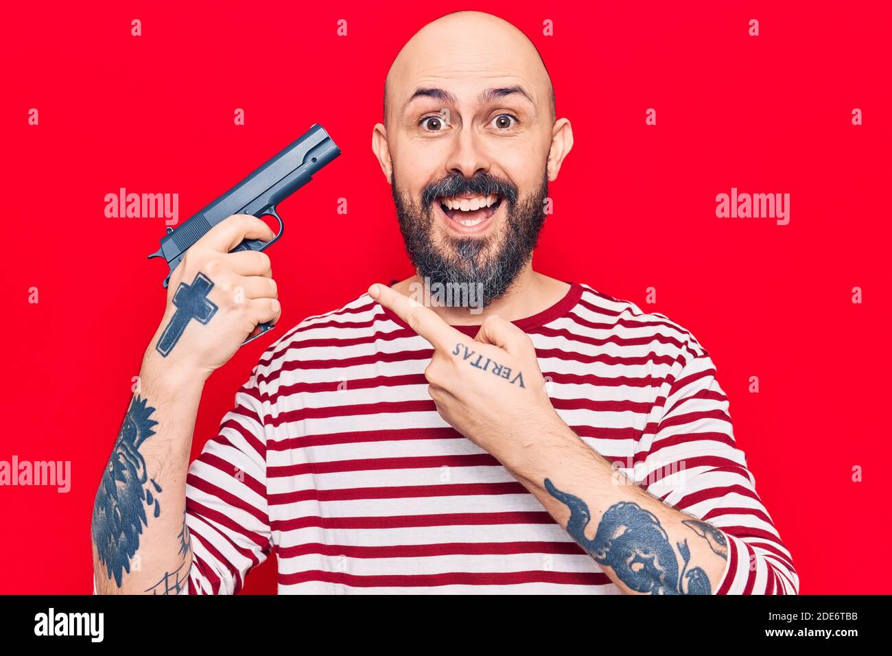 Bald criminal holding gun hi-res stock photography and images - Alamy
