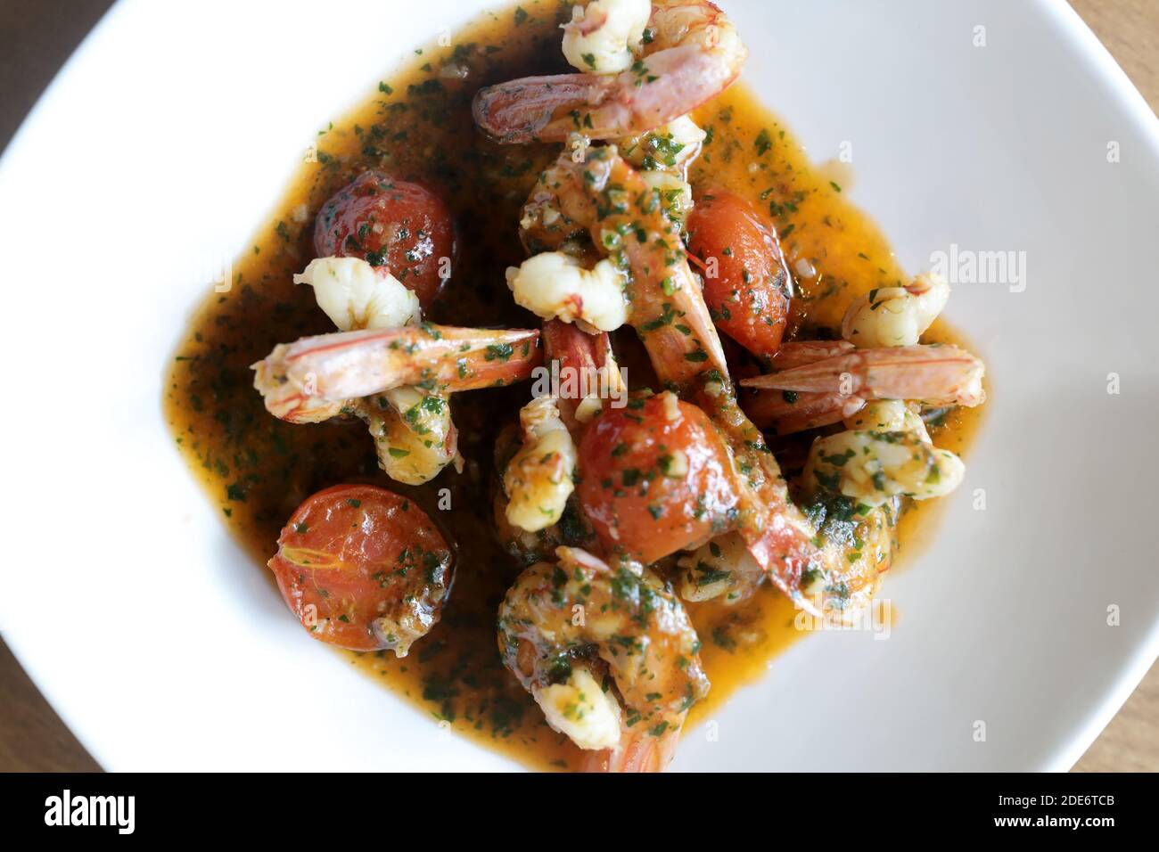Stewed prawns with vegetables in the restaurant Stock Photo - Alamy
