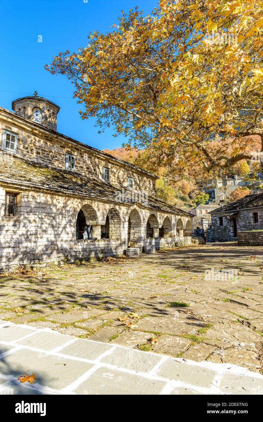 Taxiarchon stone built church during fall season in the picturesque ...