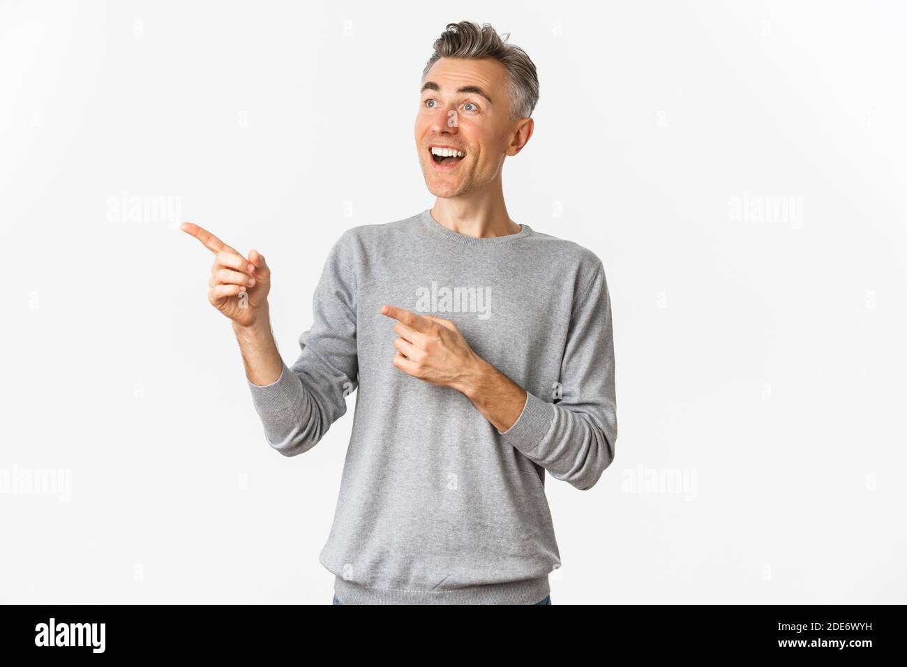 Image of happy and amazed handsome man with grey short hairstyle ...