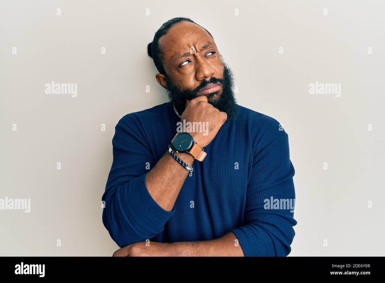 Young african american man wearing casual clothes thinking concentrated ...