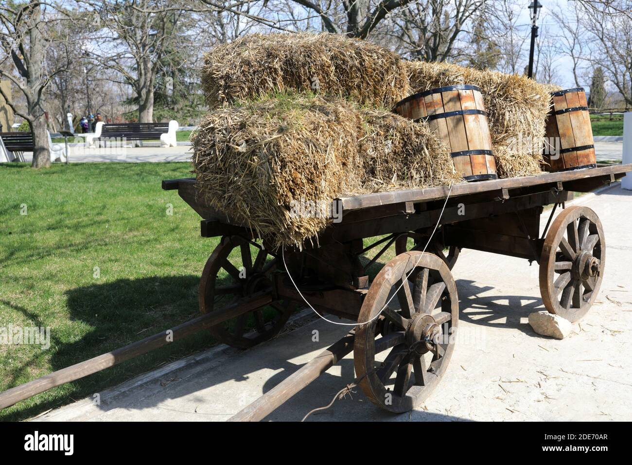 Horse wooden carriage with hay in spring Stock Photo - Alamy