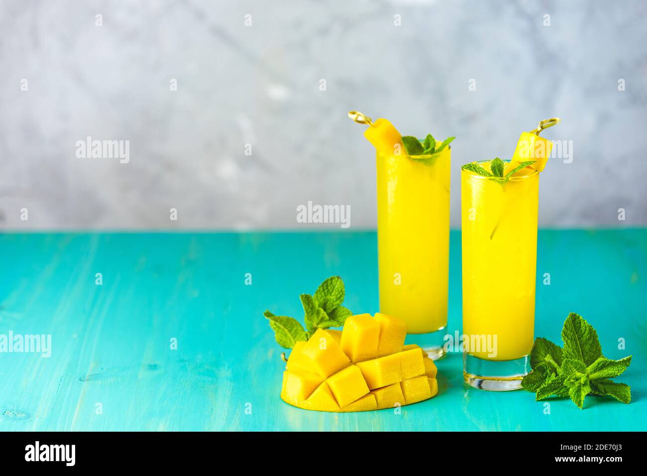 Refreshing summer cocktails made of mango, cold drink or a drink with ...