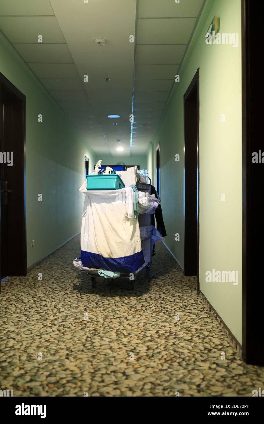View of cleaning cart in hotel corridor Stock Photo - Alamy