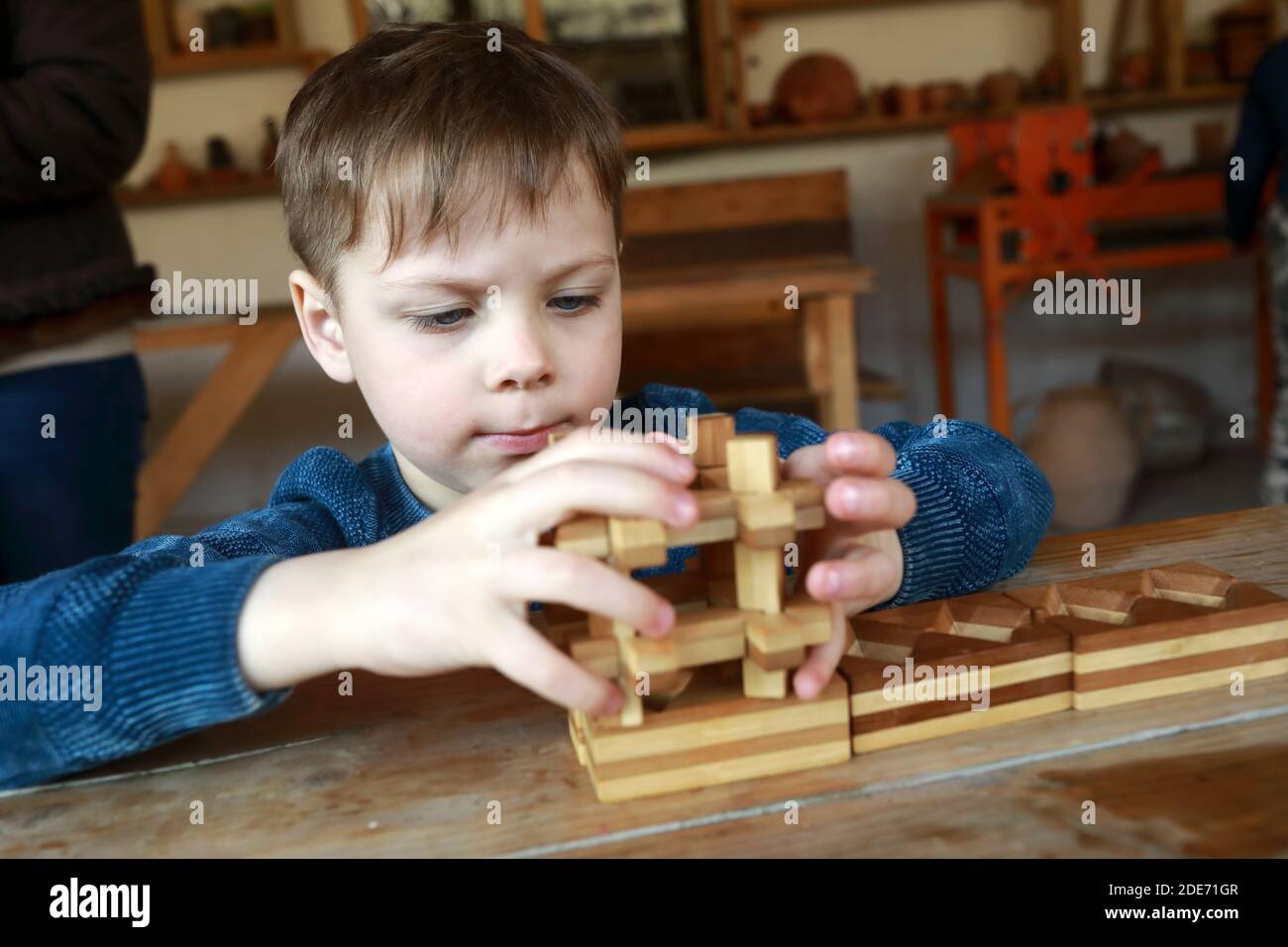 Boy working puzzle hi-res stock photography and images - Alamy