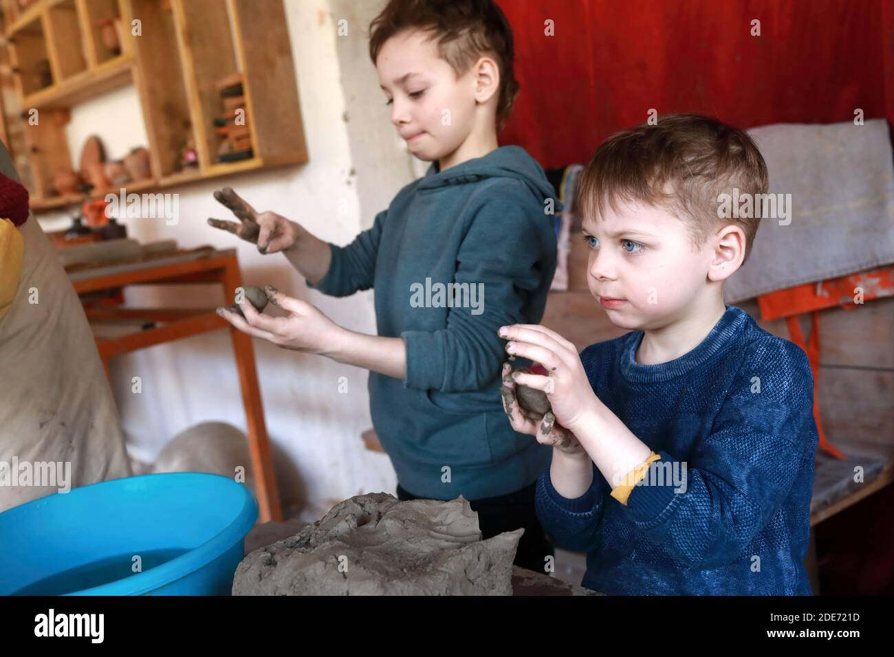 Children make clay crafts in the workshop Stock Photo - Alamy