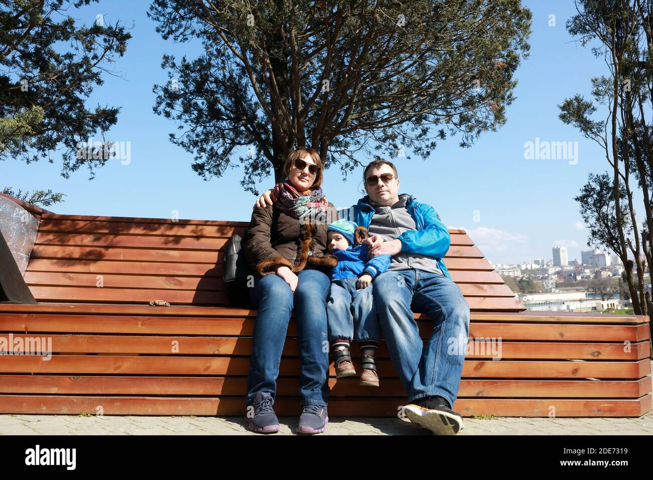 Father son in park father son sit on bench hi-res stock photography and ...