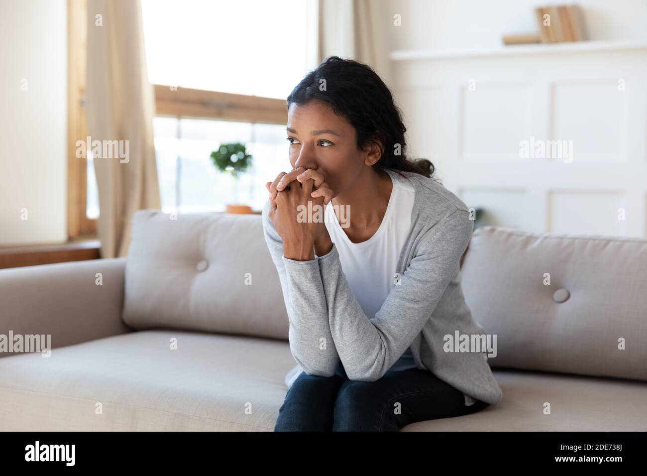 Sad African American woman feel depressed at home Stock Photo - Alamy