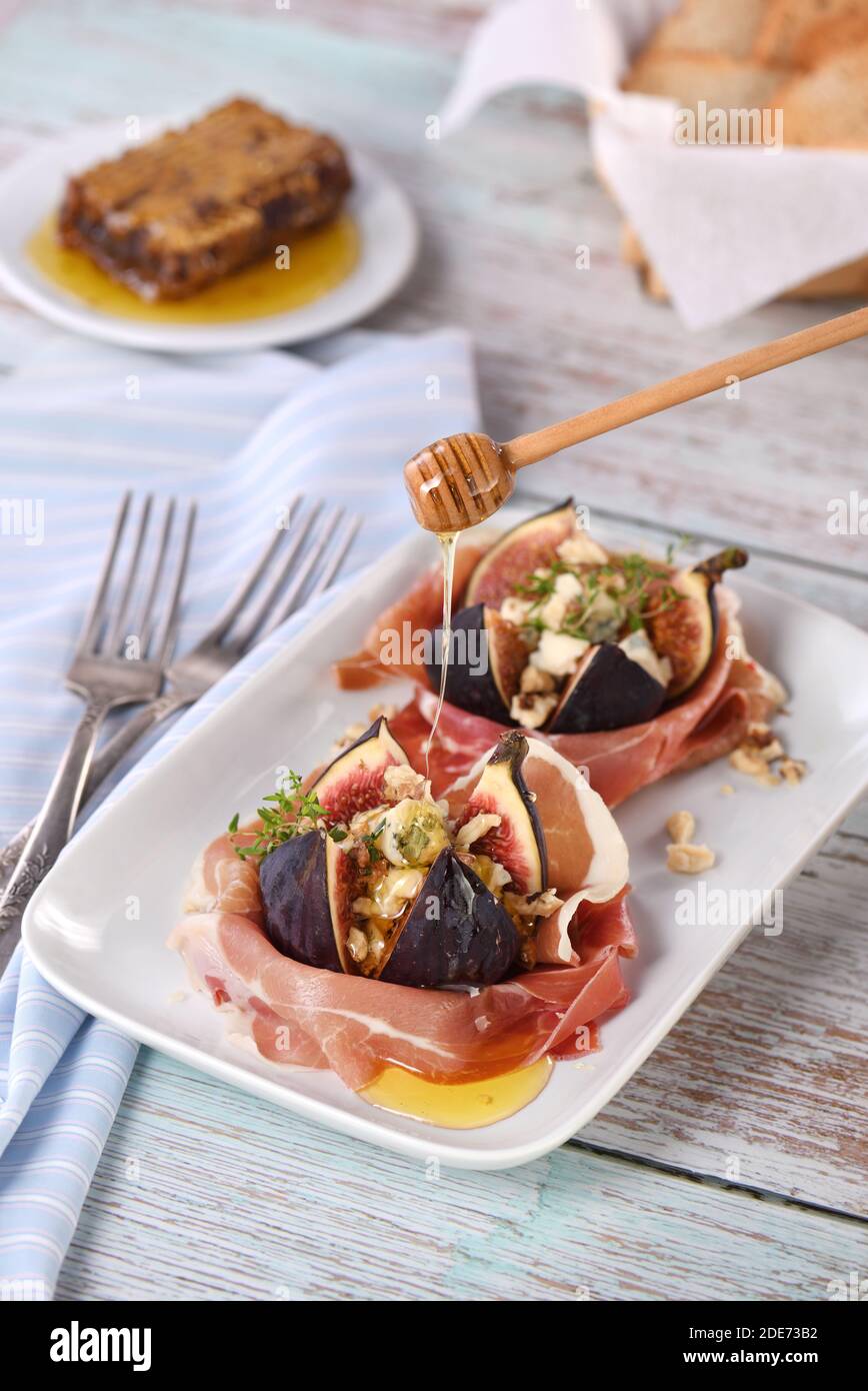 Figs stuffed with blue cheese, wrapped in Parma ham, drizzled with ...