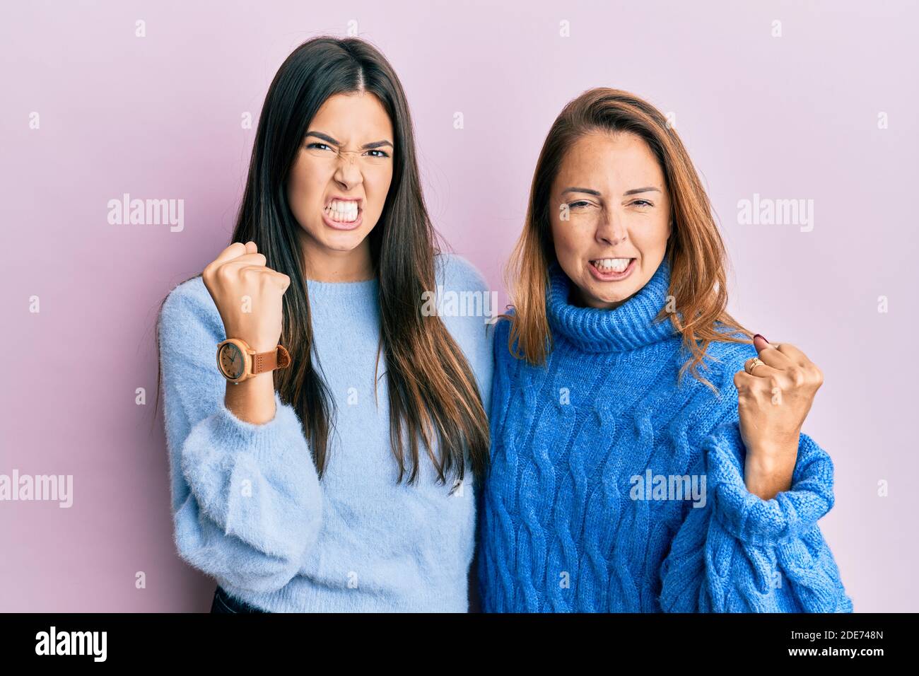 Hispanic family of mother and daughter wearing wool winter sweater ...