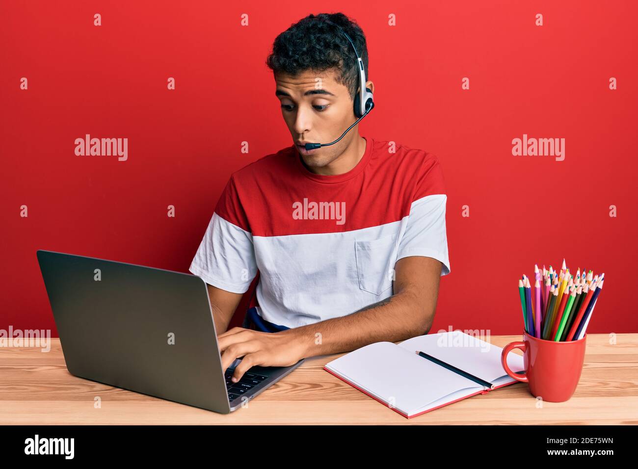Young handsome african american man working at the office wearing ...