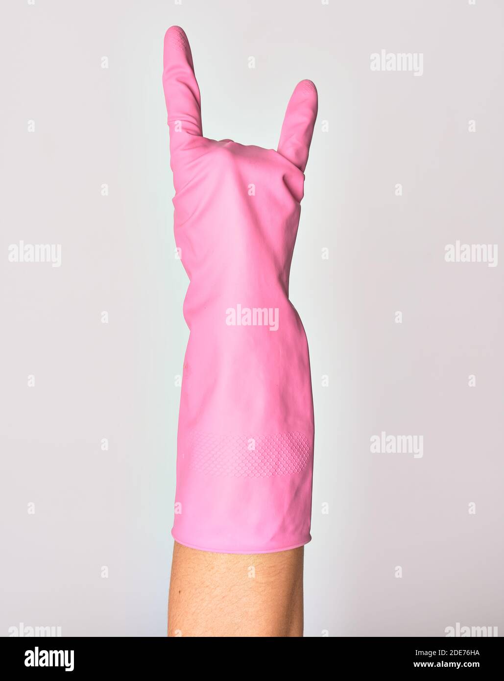 Hand of caucasian young woman wearing pink cleaning glove showing ...