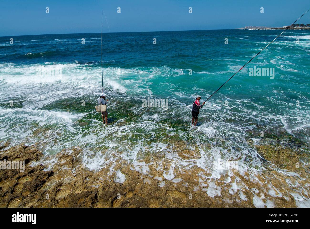 05-31-2007 Alexandria , Egypt . Fishermen (2)on coast of Mediterranean ...