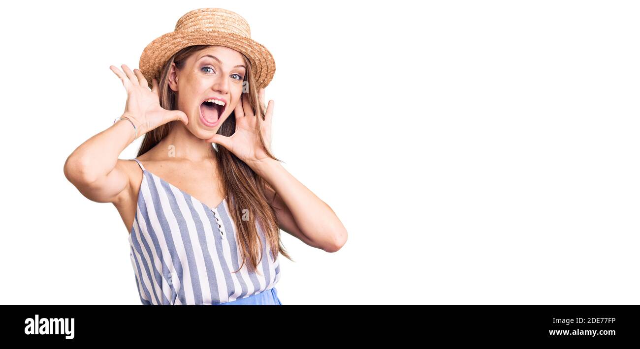 Young beautiful blonde woman wearing summer hat smiling cheerful ...
