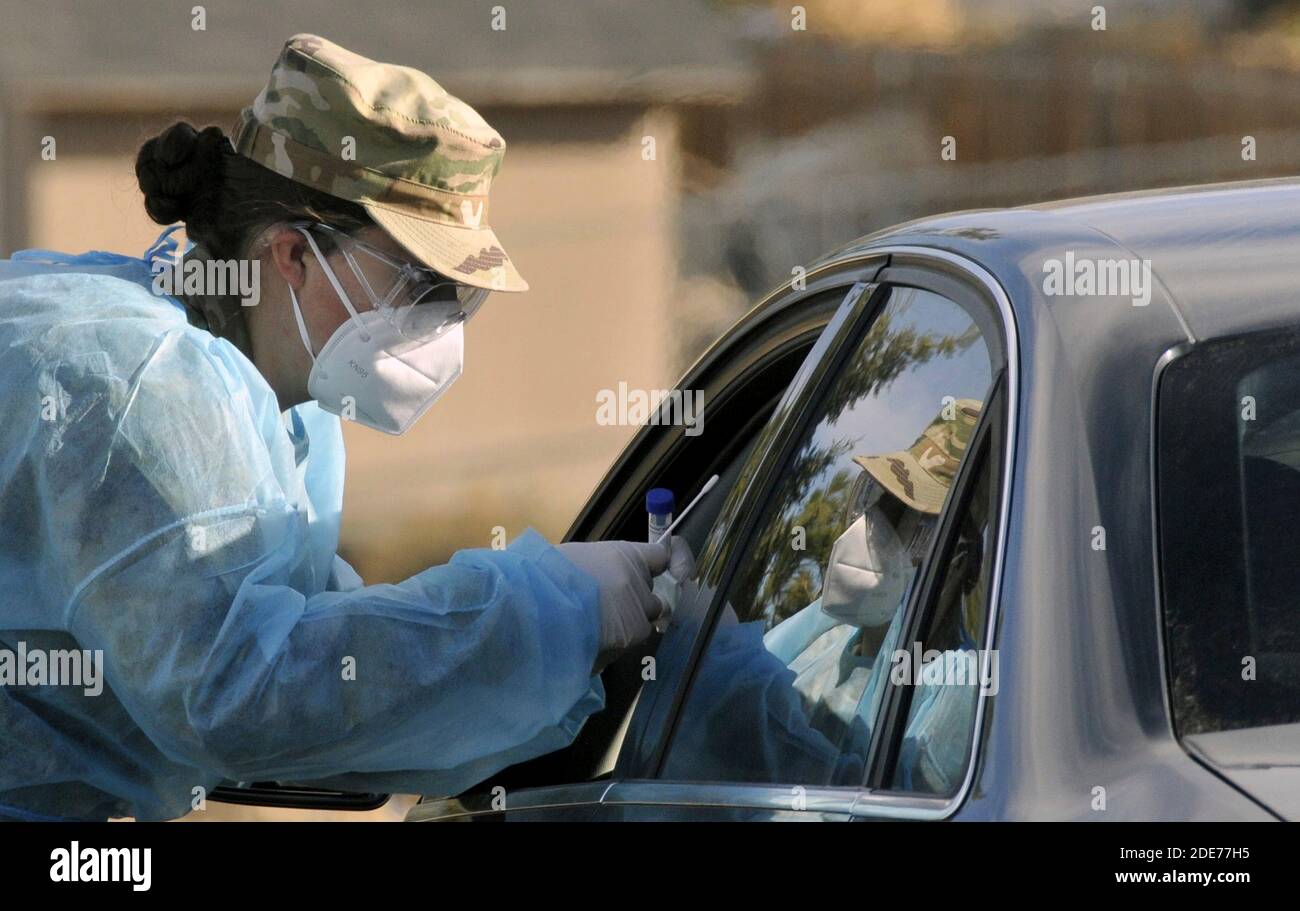 A Nevada Guard Airman prepares to swab a Native American resident ...