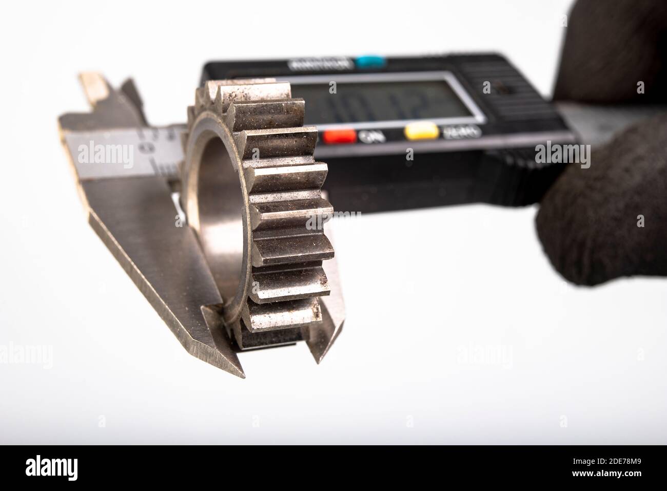 Measuring the gears with a caliper. Engineering work in the laboratory ...