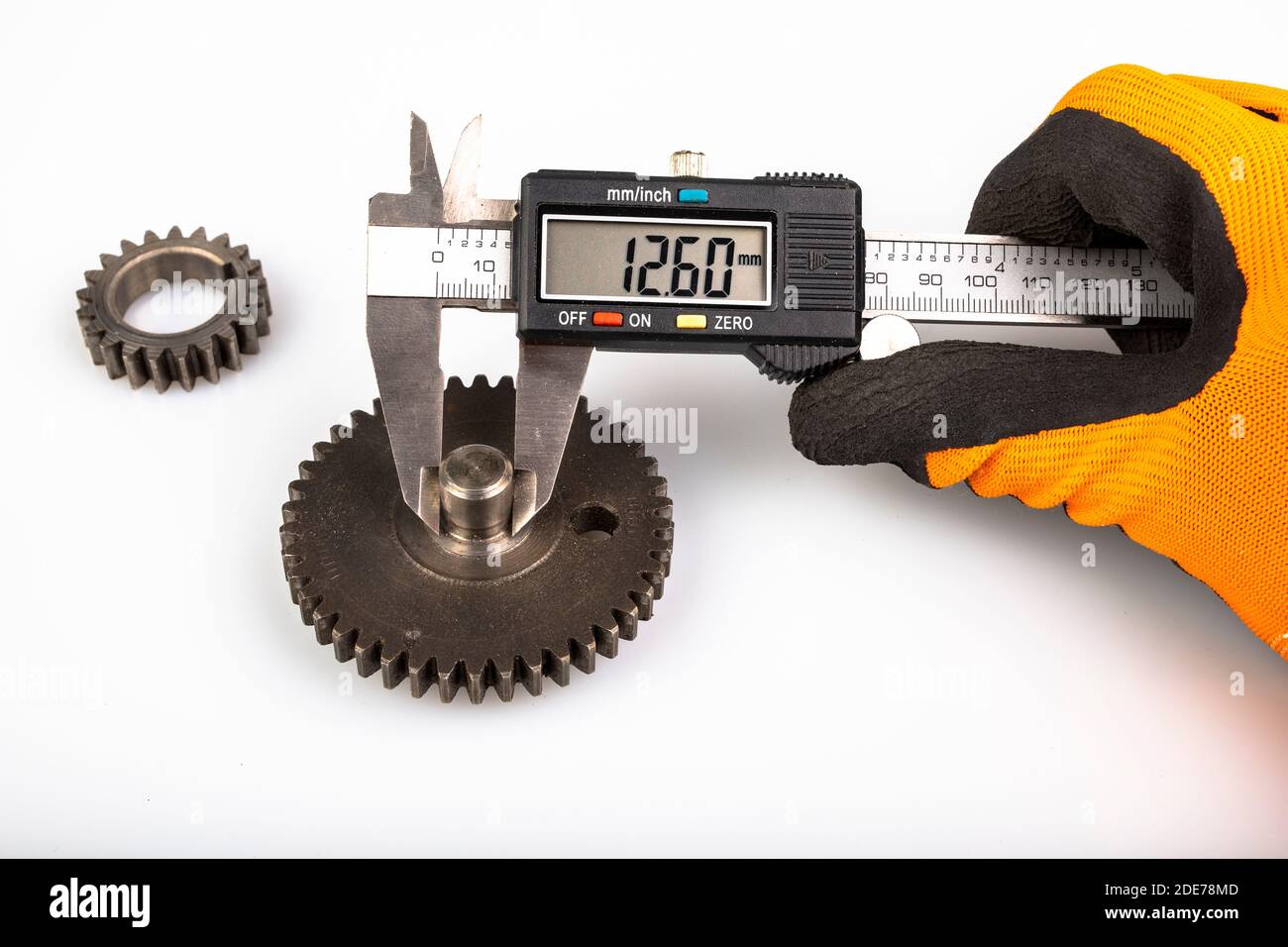 Measuring the gears with a caliper. Engineering work in the laboratory ...