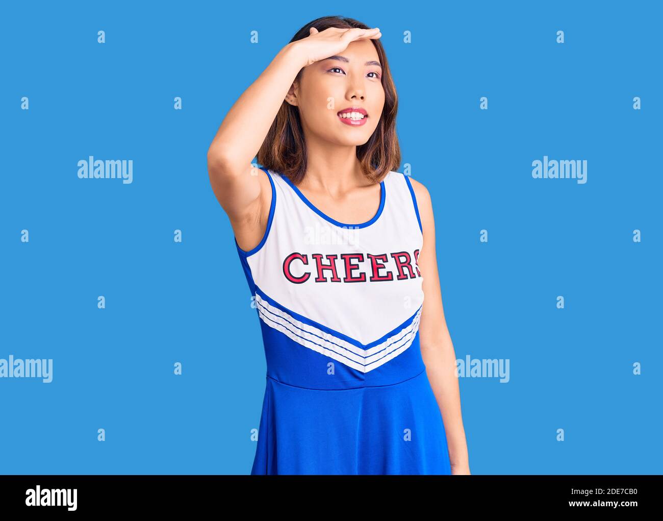 Young Beautiful Chinese Girl Wearing Cheerleader Uniform Very Happy And 7803