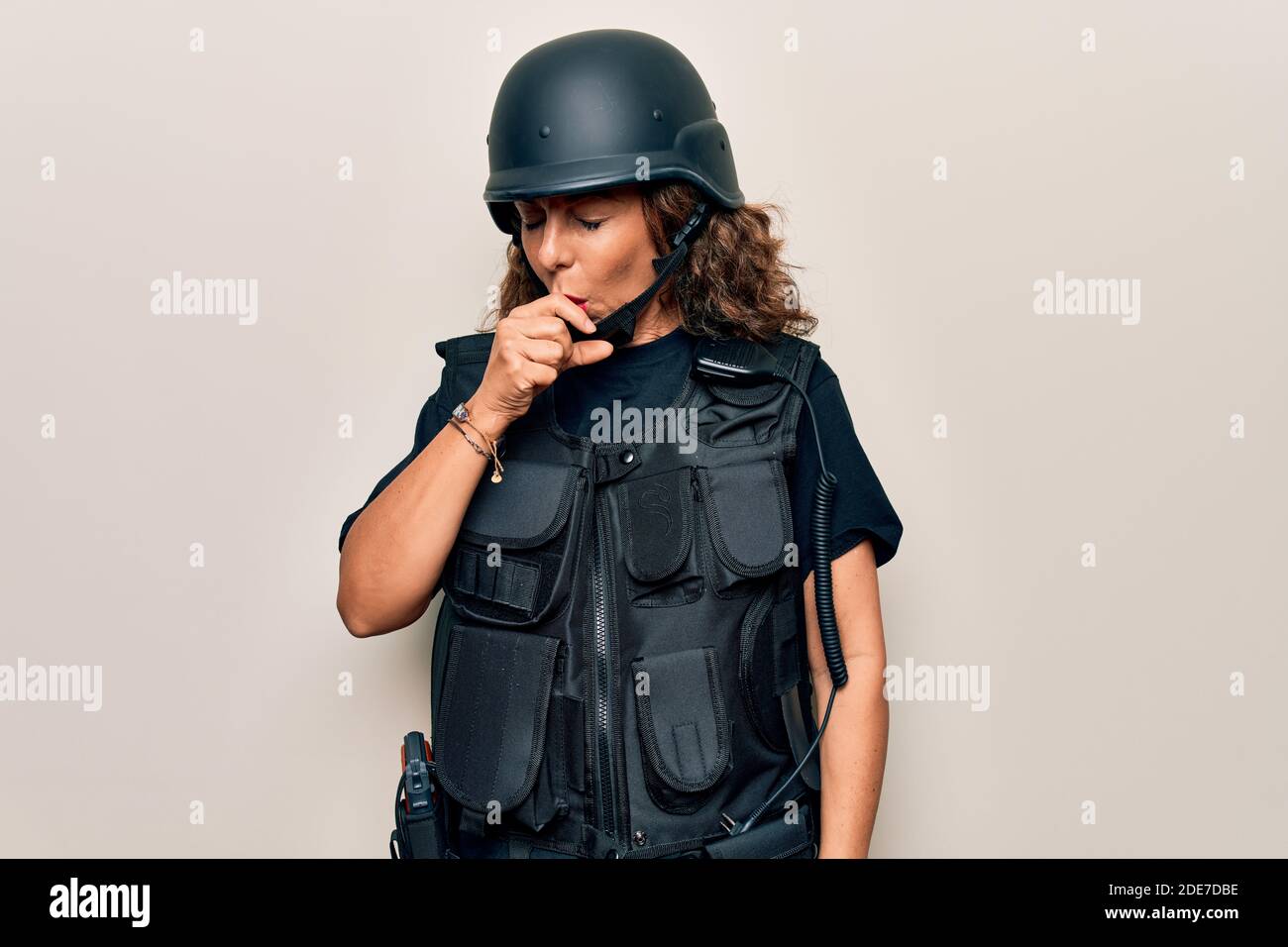 Middle age beautiful soldier woman wearing bulletproof uniform and ...