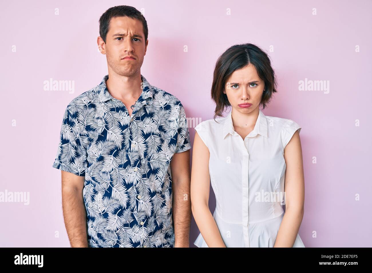 Beautiful couple wearing casual clothes depressed and worry for ...