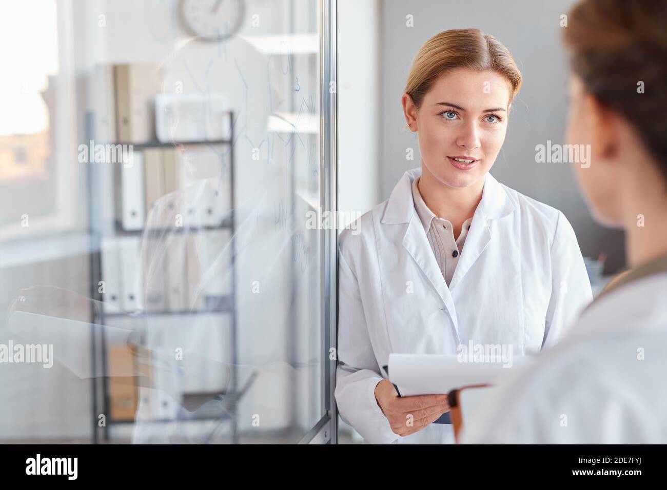 Scientists talking in lab hi-res stock photography and images - Alamy