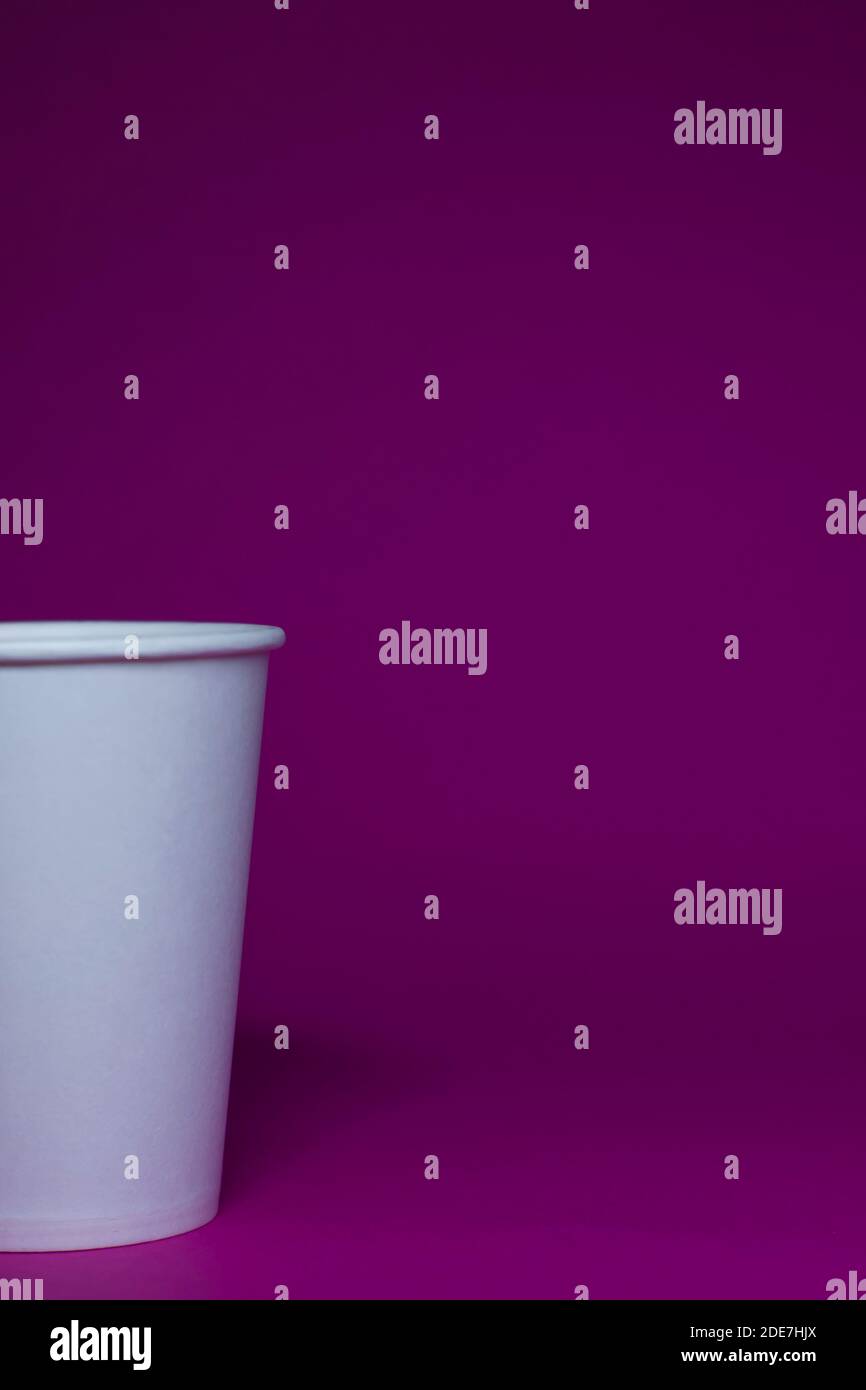 An empty white paper cup on a pink background. horizontal photo Stock ...