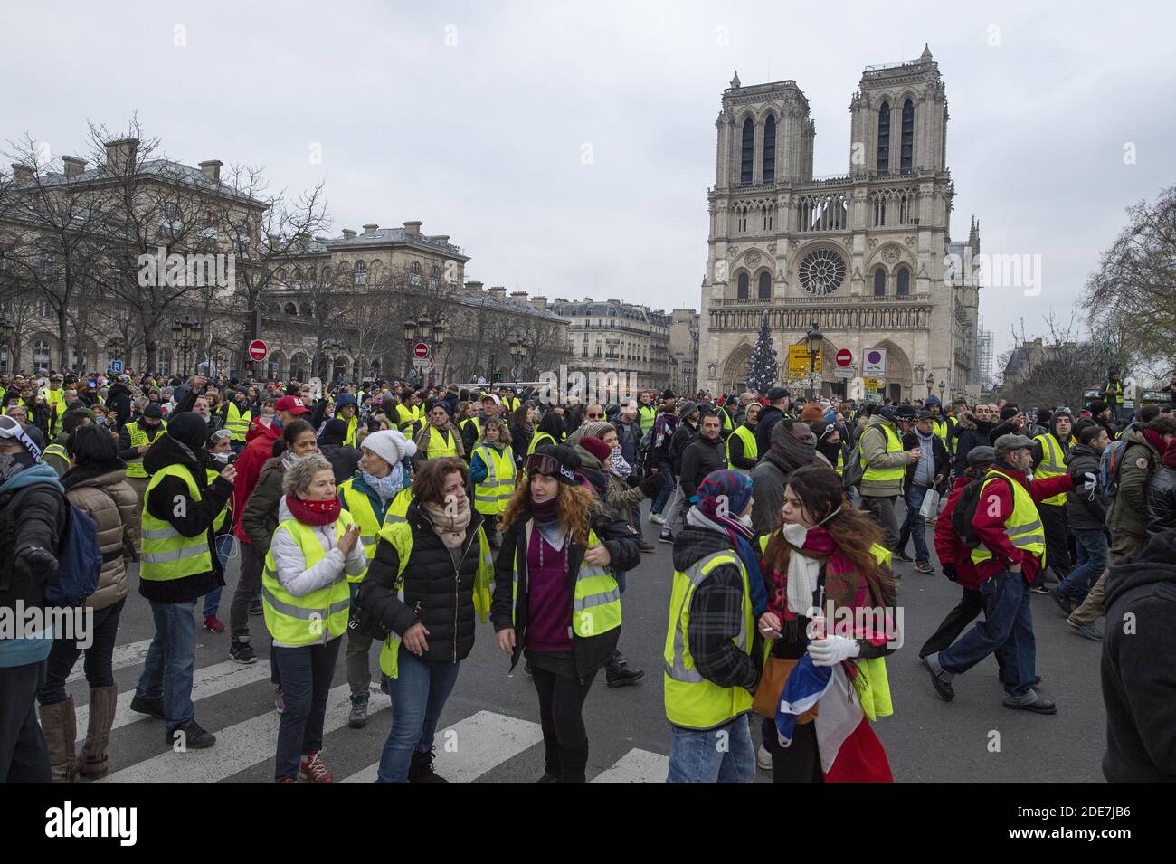 Protesters wearing yellow vests take part in a demonstration by the ...