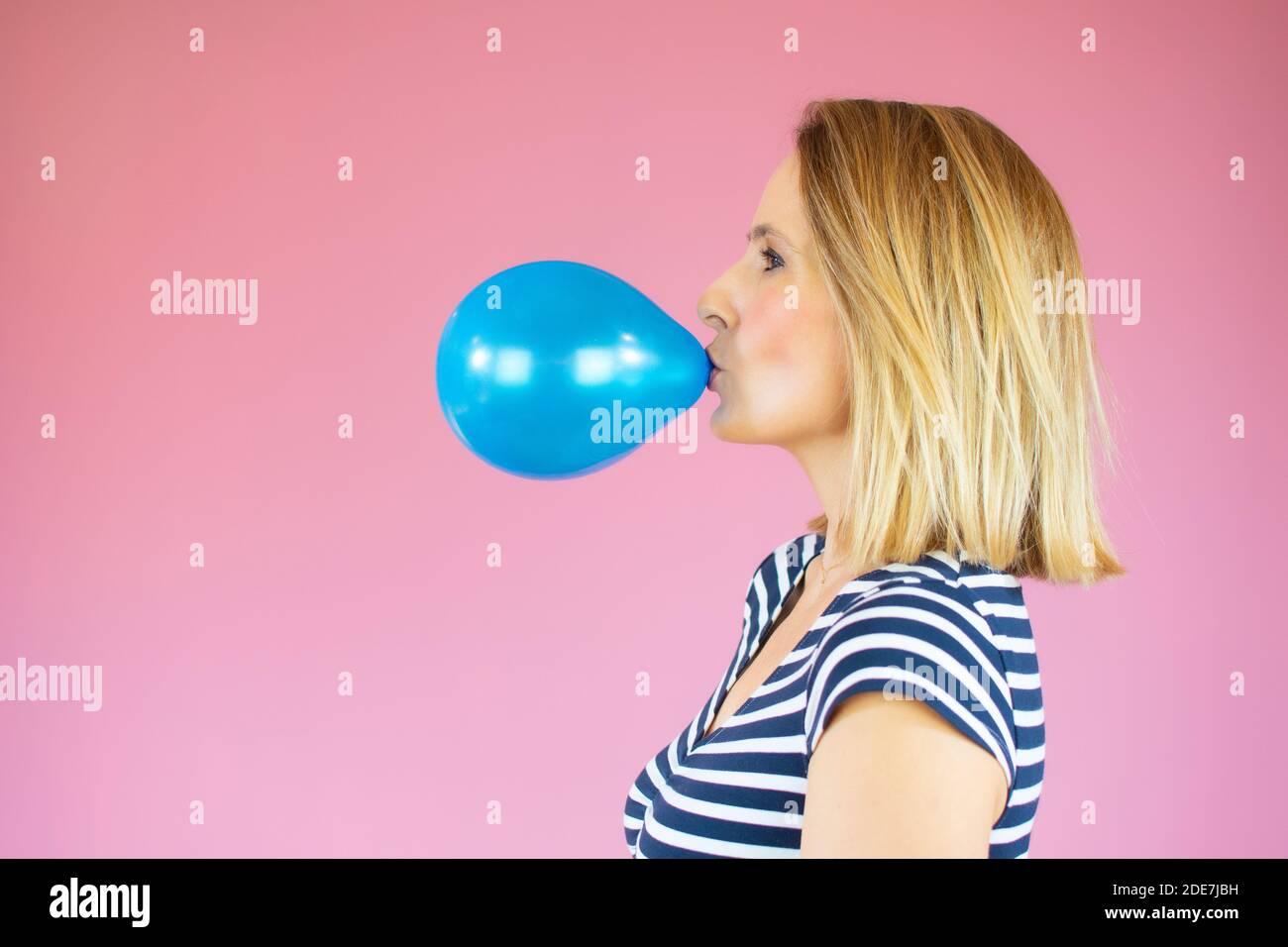 Close up photo of charming nice cute serious focused woman inflating ...