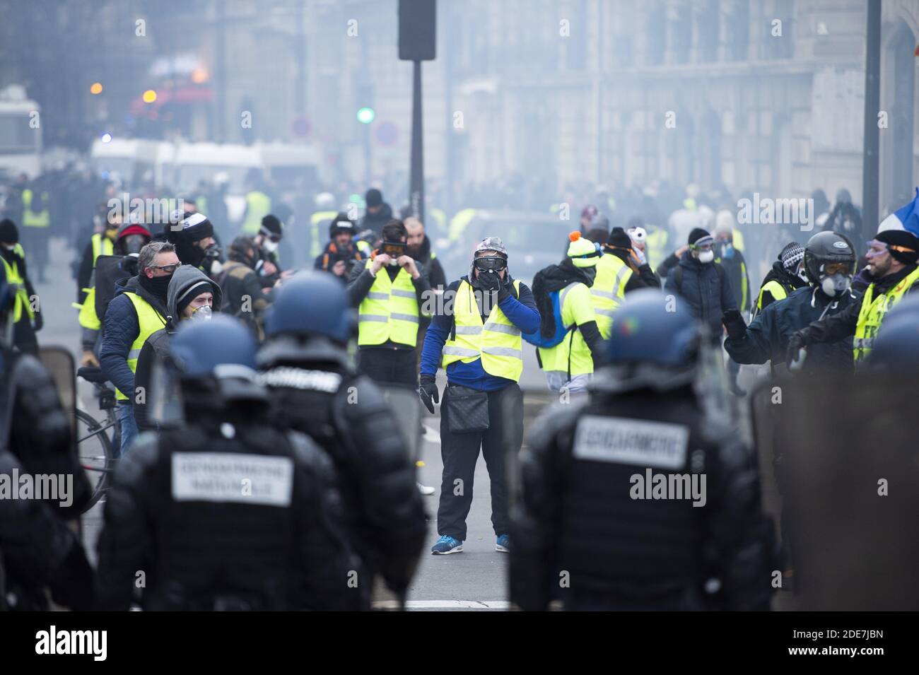 Protesters wearing yellow vests take part in a demonstration by the ...