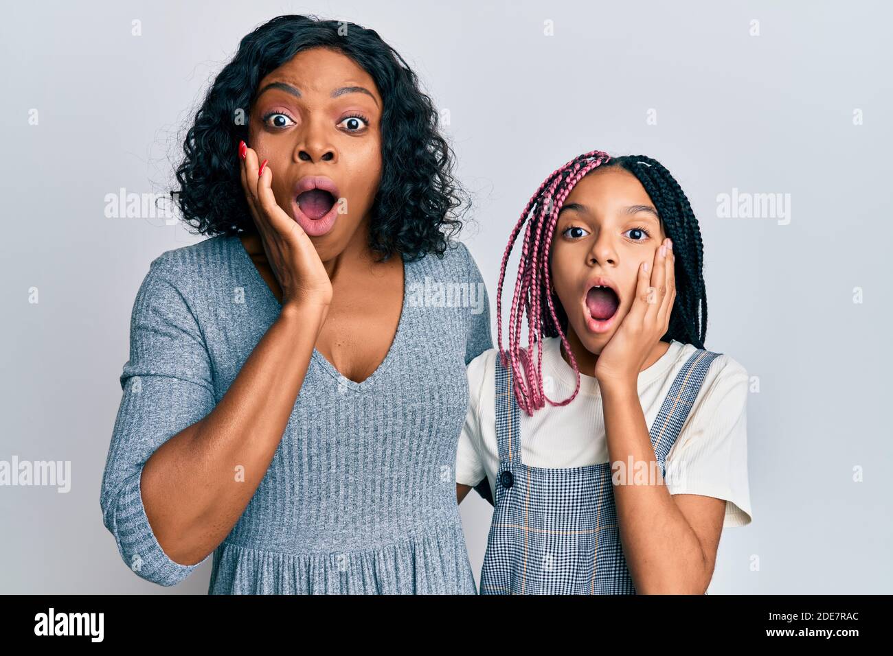 Beautiful african american mother and daughter wearing casual clothes ...