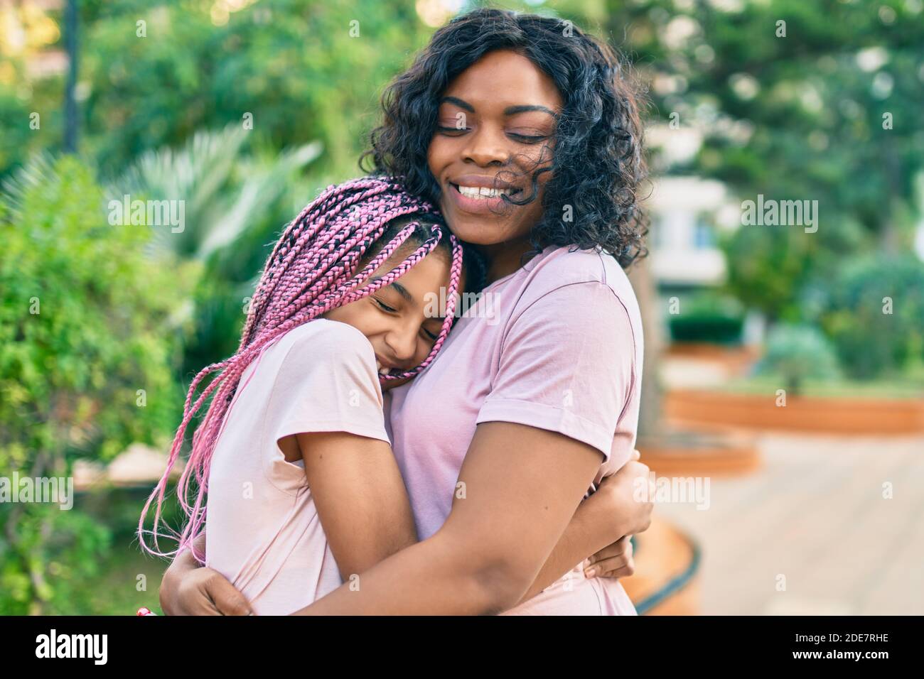 Beautiful african american mother and daughter smiling happy and ...