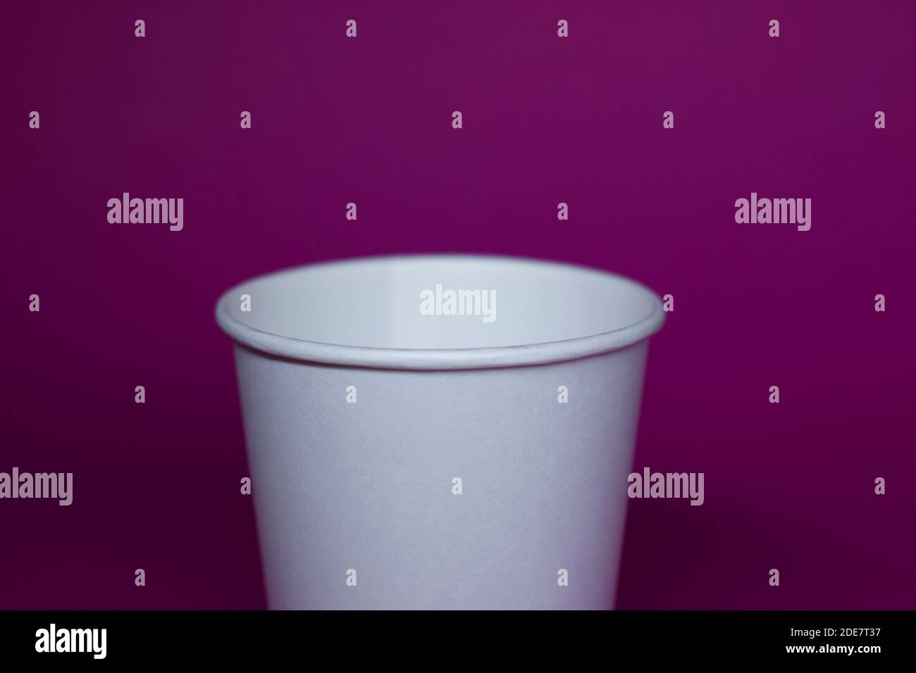 An empty white paper cup on a pink background. horizontal photo Stock ...