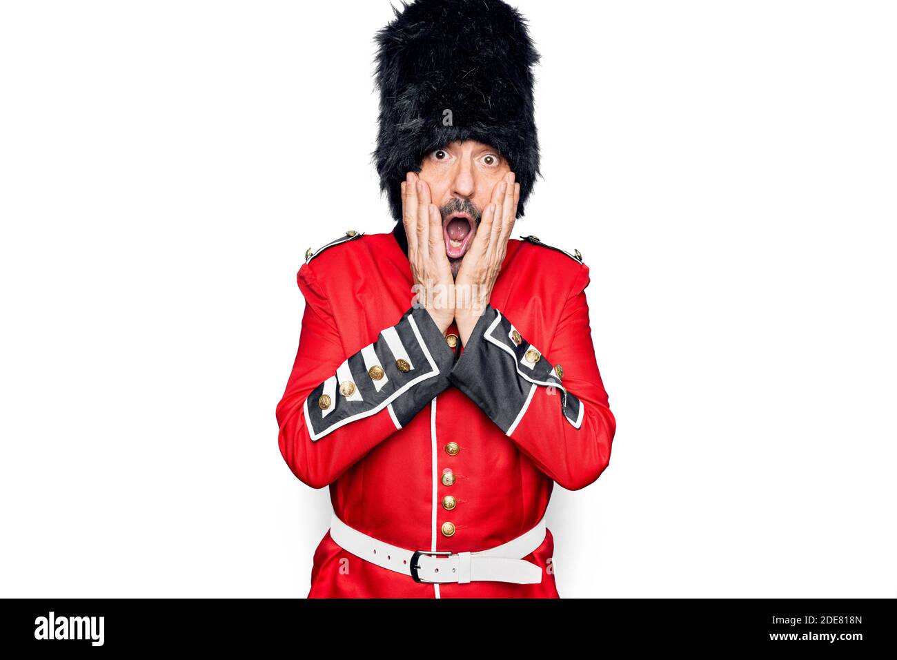 Middle age handsome wales guard man wearing traditional uniform over ...