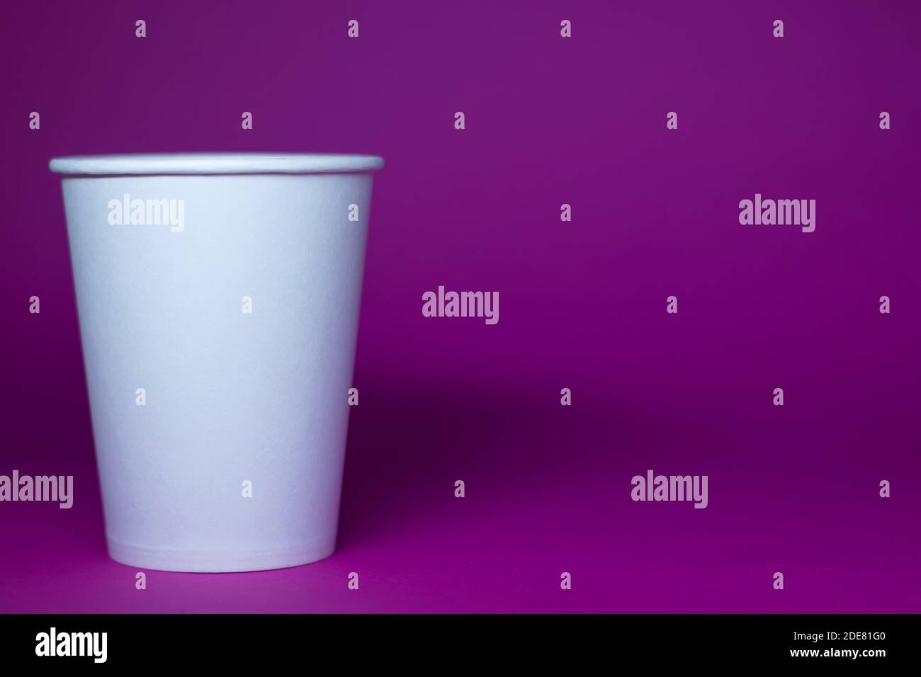 An empty white paper cup on a pink background. horizontal photo Stock ...