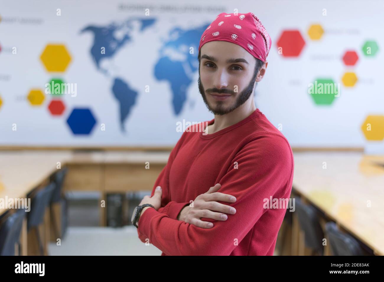Attractive Male Student Posing In Classroom Stock Photo - Alamy