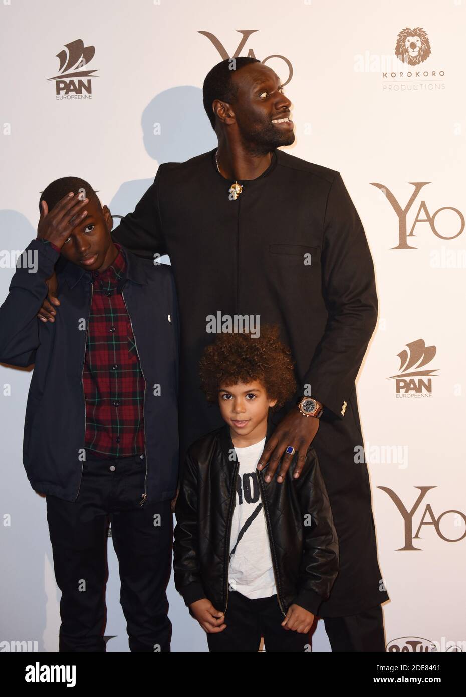 Lionel Louis-Basse, Omar Sy, Aristote Laios attending the YAO Premiere ...