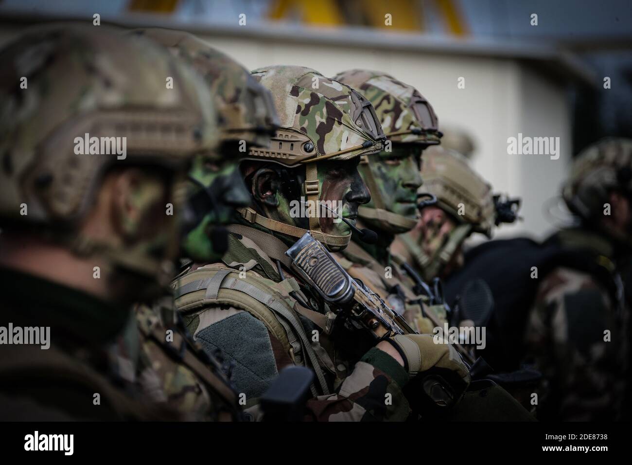Members of a French parachute commando prepare for a military ceremony ...