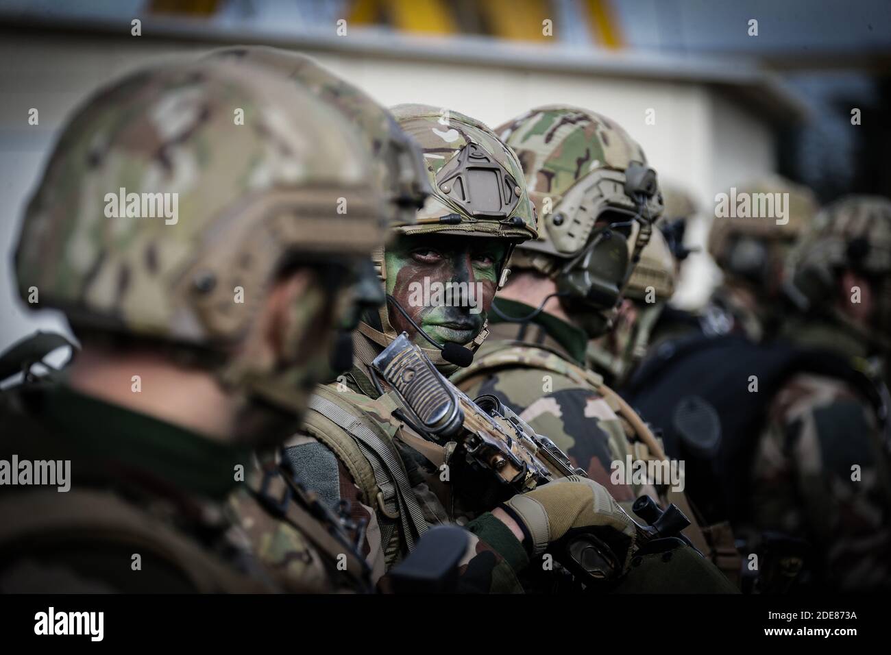 Members of a French parachute commando prepare for a military ceremony ...