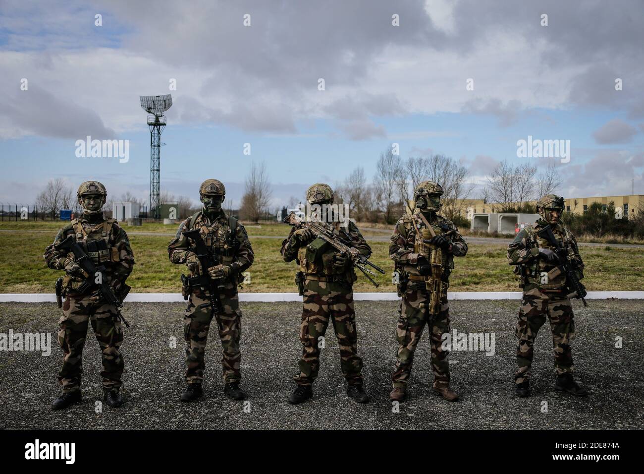 Members of a French parachute commando prepare for a military ceremony ...