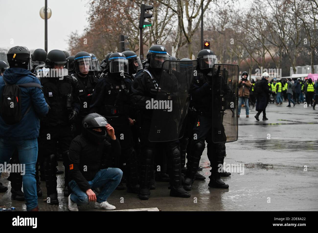 BAC (French anti-crime brigade) members and police officers stand ...