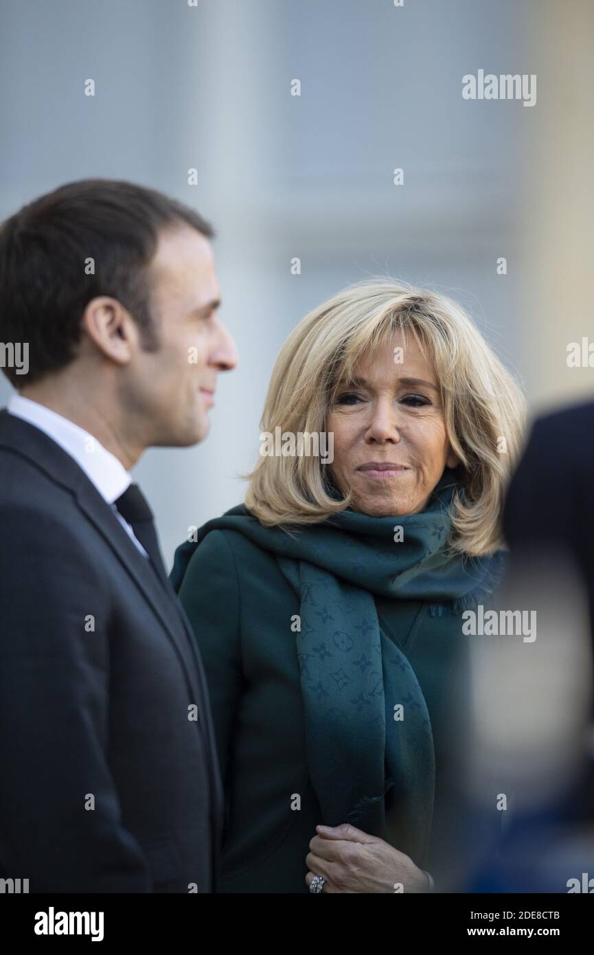 French President Emmanuel Macron and his wife Brigitte Macron receive ...