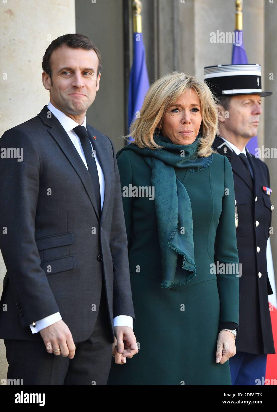 French President Emmanuel Macron and his wife Brigitte Macron await ...