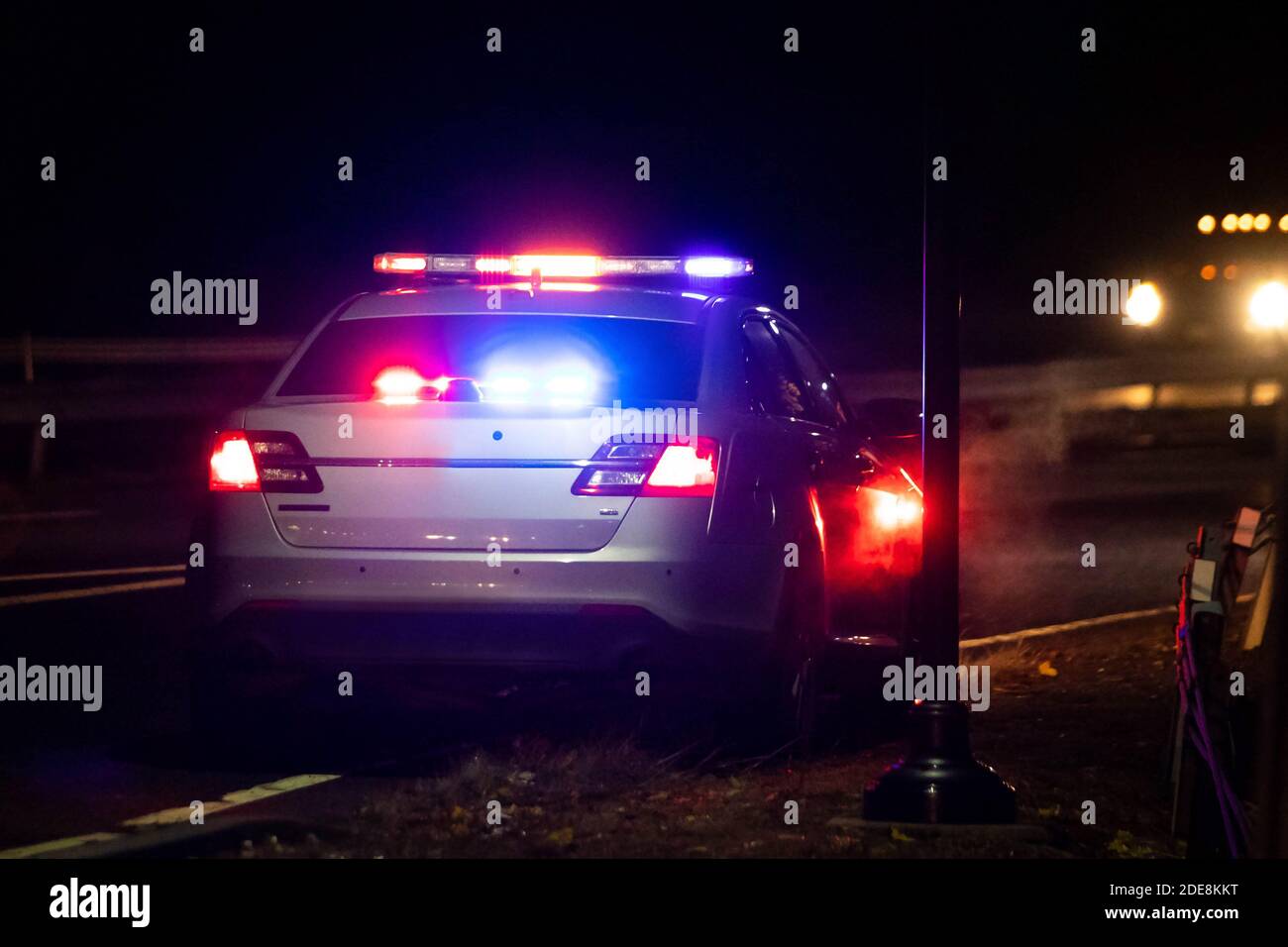 Police emergency flash lights at night from the back on highway Stock ...