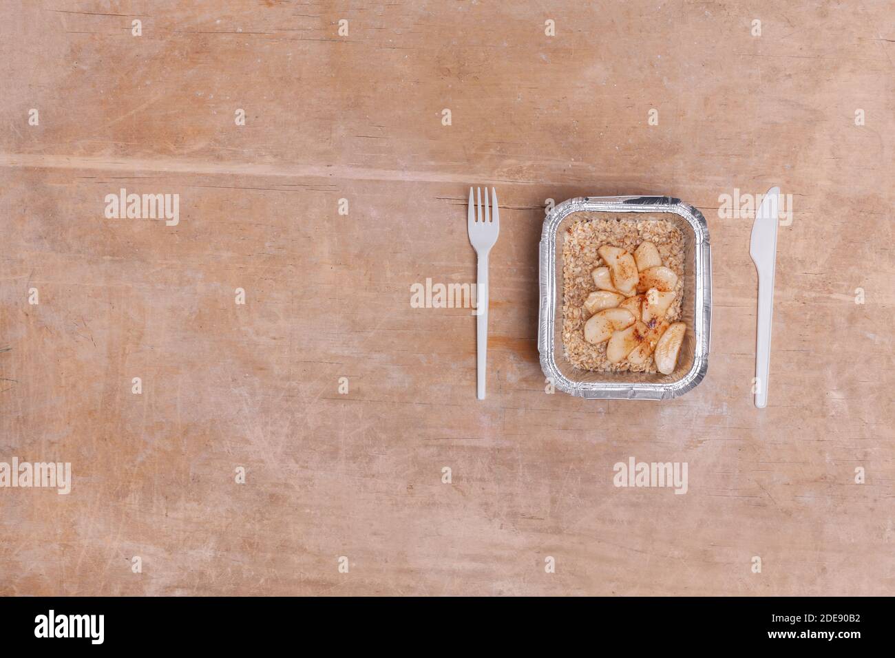 healthy food delivery or takeaway lunch box with oatmeal and apple in ...