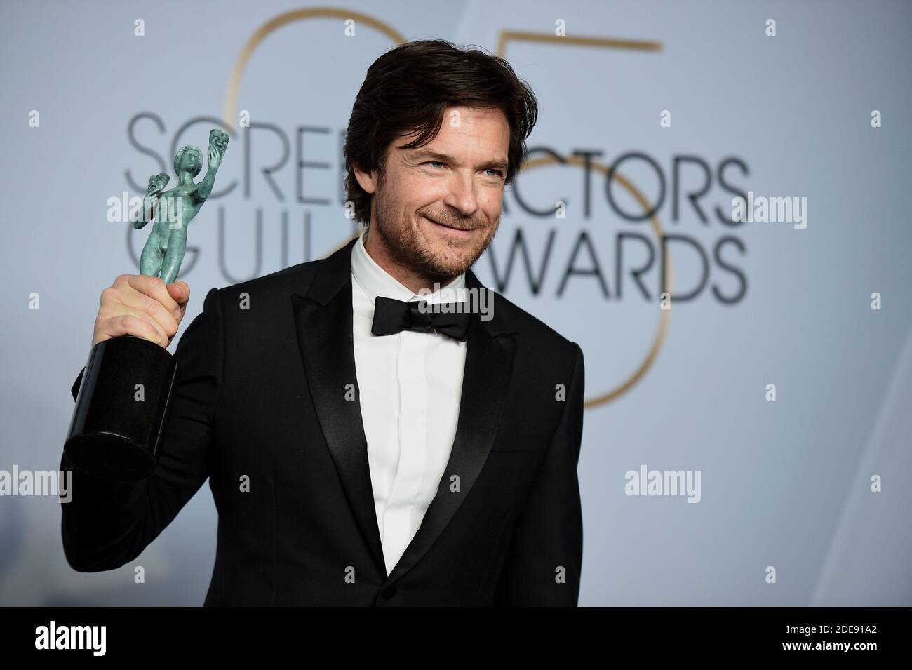 Jason Bateman poses in the press room during the 25th Annual Screen ...