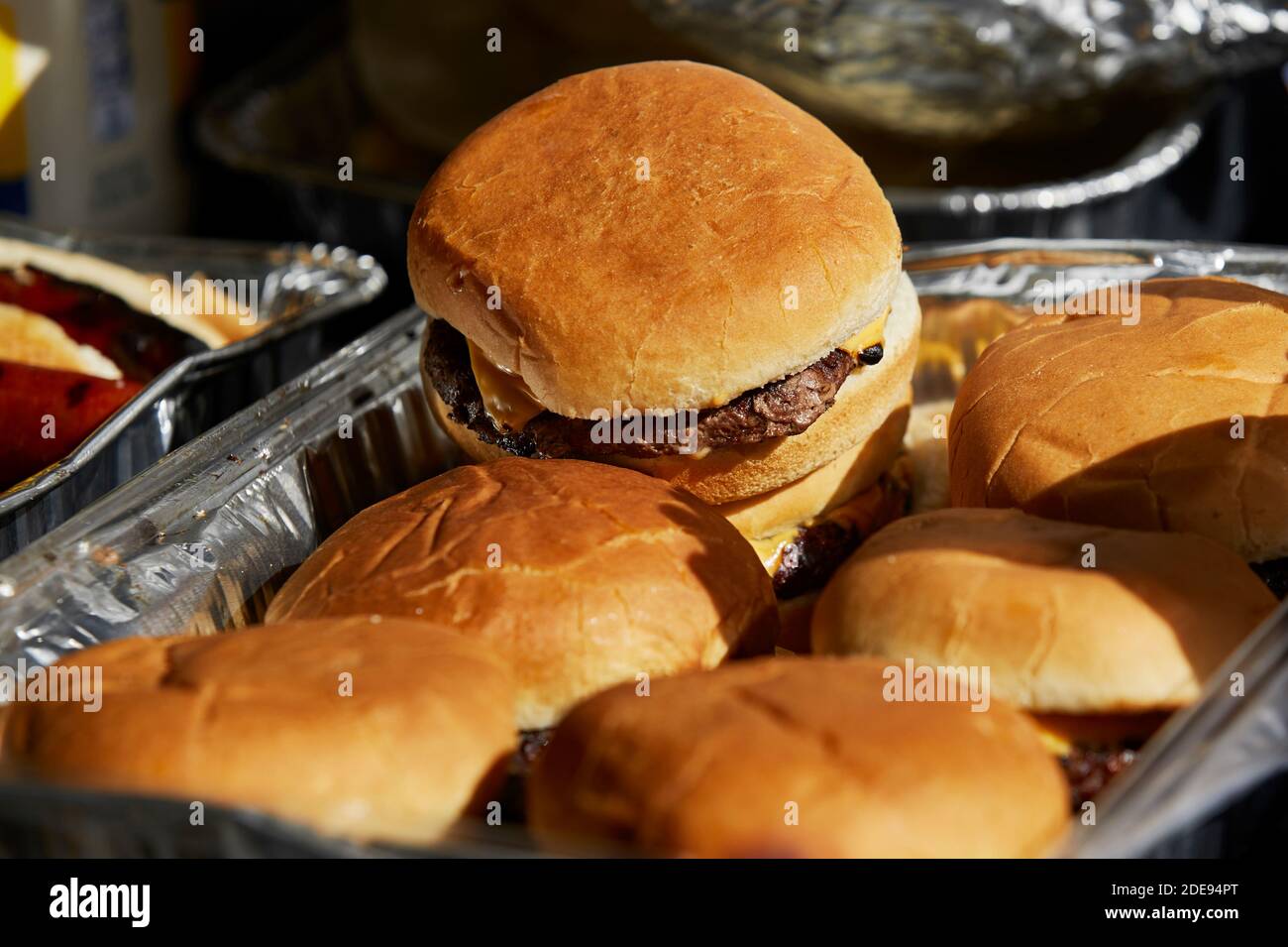 Alumininum tray with hamburgers and shallow depth of field Stock Photo ...