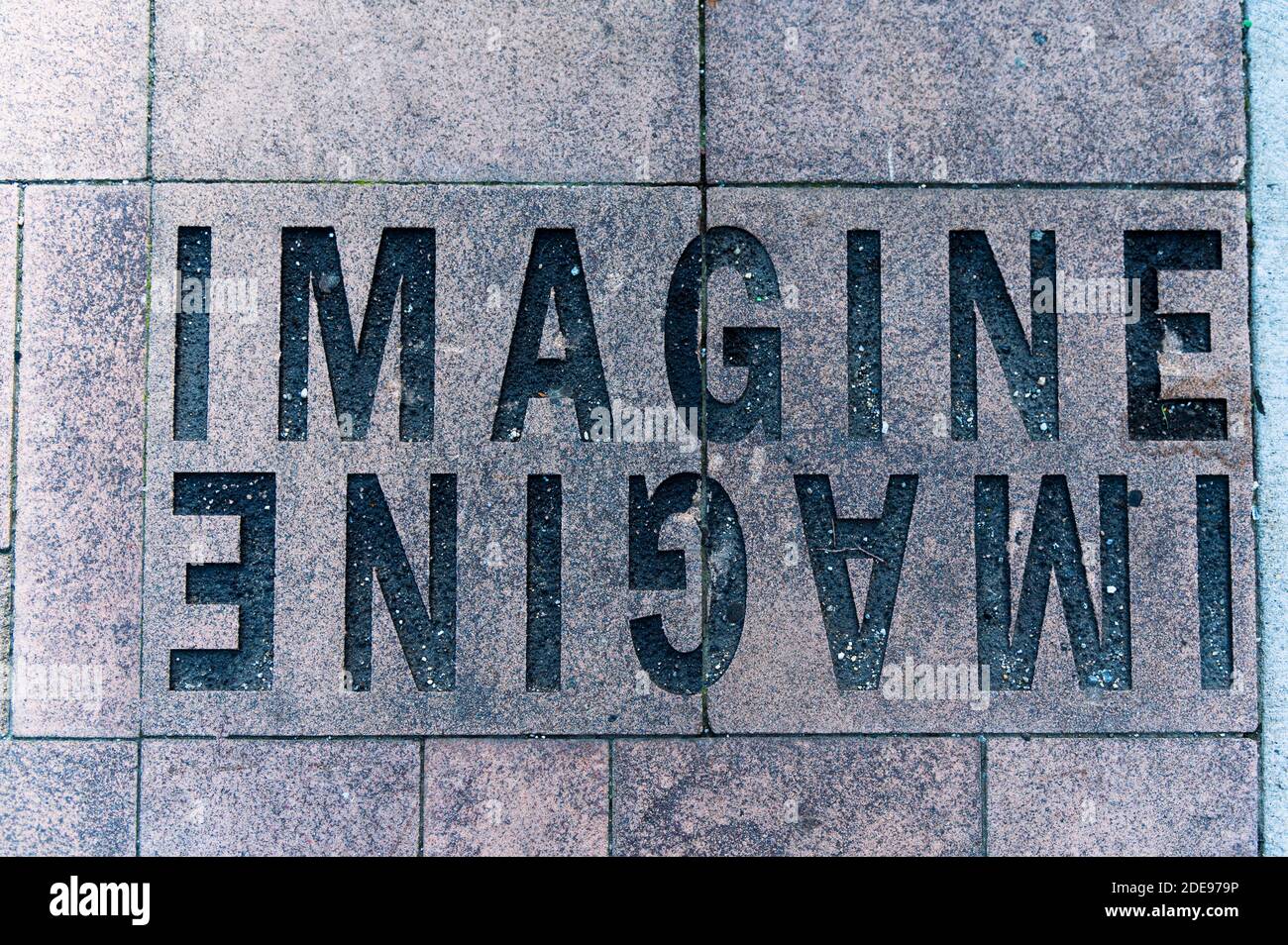 the word imagine on sidewalk Stock Photo - Alamy