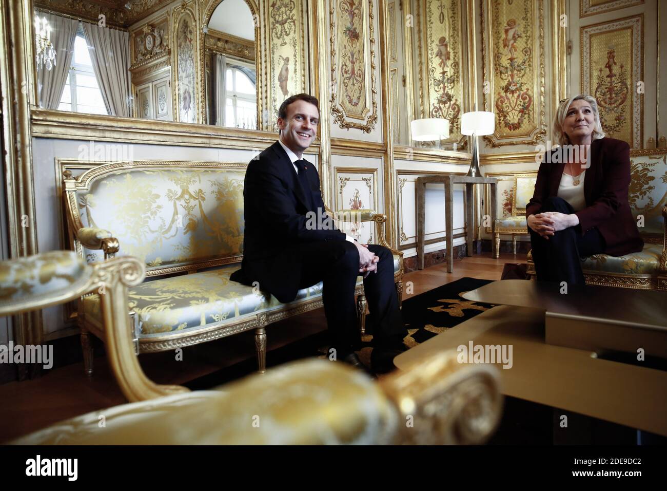 French President Emmanuel Macron (L) attends a meeting with French far ...